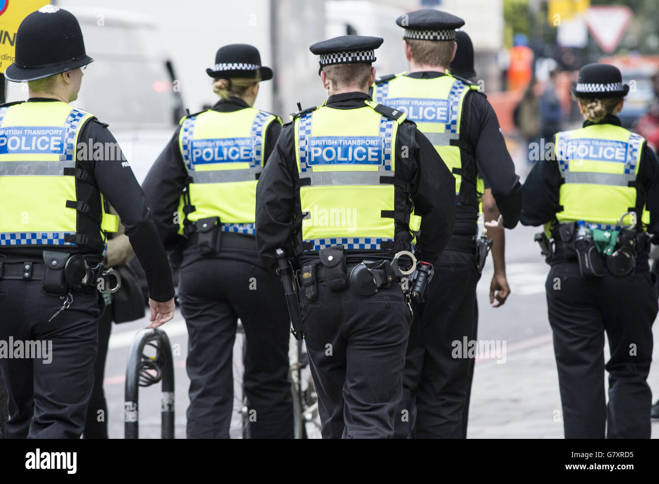 Six British Transport Police officers patrol the street in Highbury ...