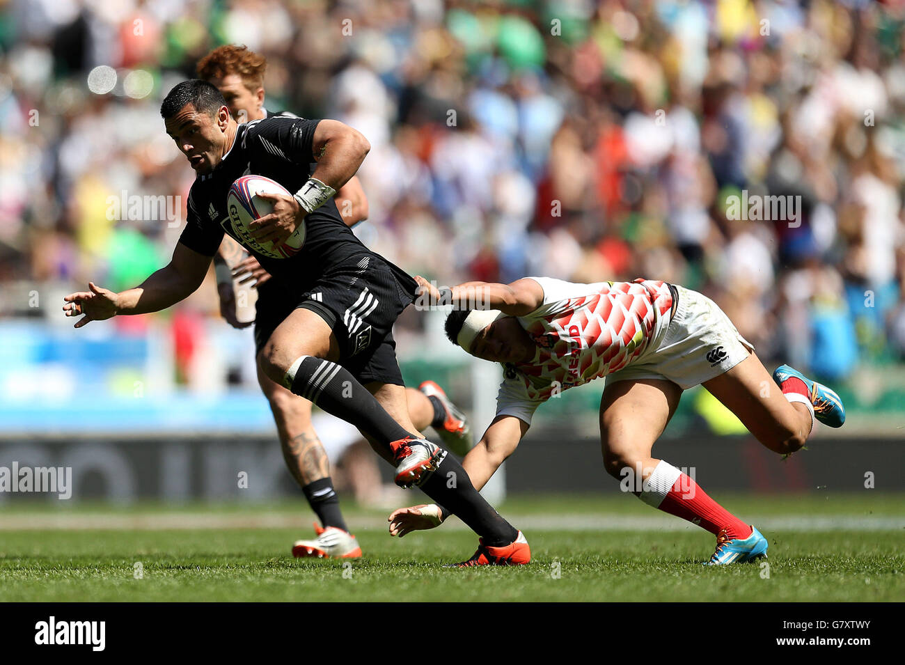 New Zealand's Sherwin Stowers is tackled by Japan's Kazuhiro Goya in ...