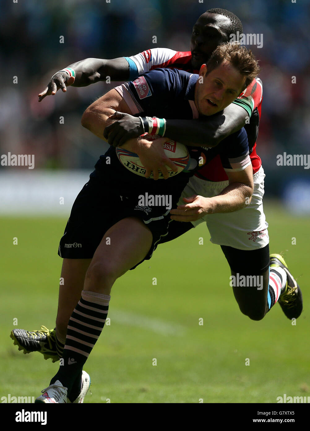 Scotland's Mark Robertson is tackled by Kenya's Collins Injera in the ...