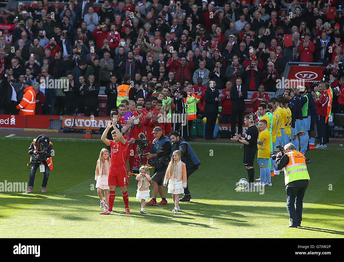 Liverpool's Steven Gerrard applauds the Anfield crowd as he is greeted ...