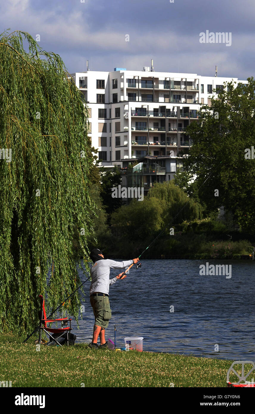 Berlin, Germany. 26th June, 2016. Fishermen sit on the banks of the ...