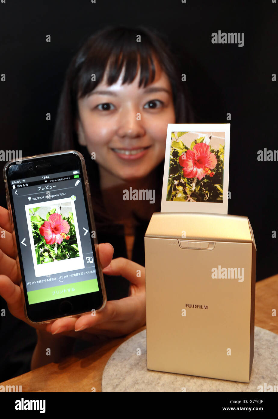 Tokyo, Japan. 27th June, 2016. Japanese camera giant Fujifilm employee ...