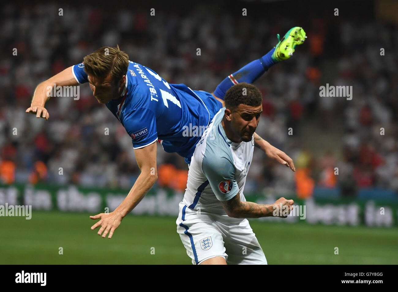 Elmar Bjarnason (top) of Iceland and Kyle Walker of England vie for the ...