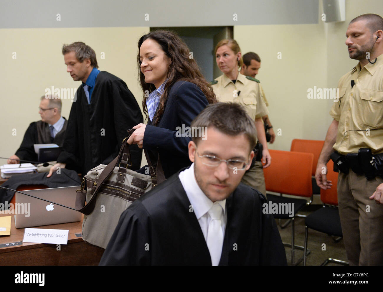 Defendant Beate Zschaepe (C) arrives at a courtroom to take her seat ...