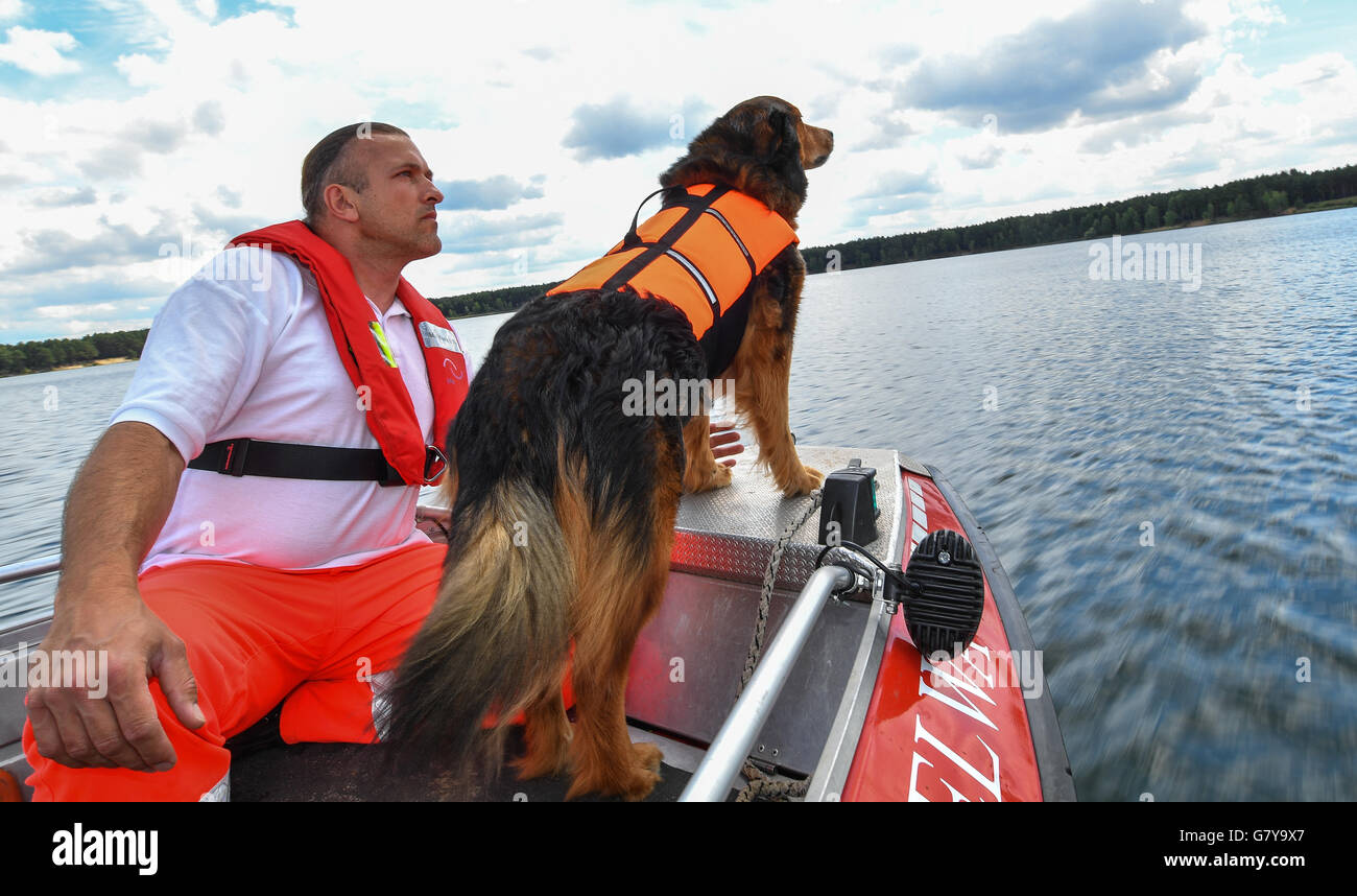 Dog handler Christian Arlt of the German Red Cross (DRK) and his water ...
