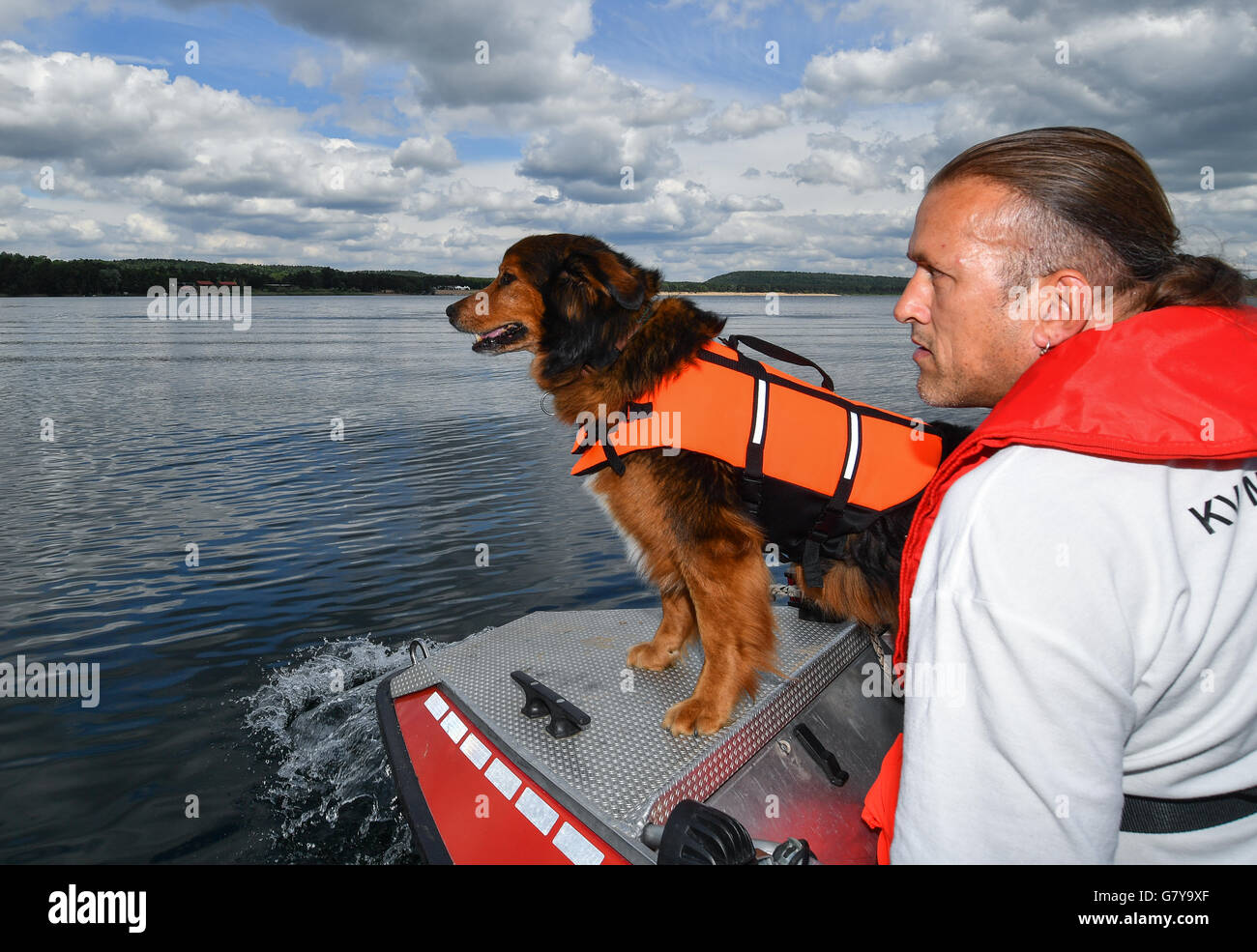 Dog handler Christian Arlt of the German Red Cross (DRK) and his water ...