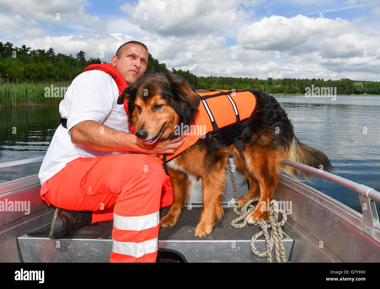 Dog handler Christian Arlt of the German Red Cross (DRK) and his water ...