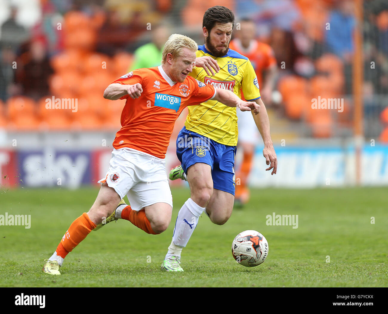 Blackpool's David Perkins and Huddersfield Town's Jacob Butterfield ...