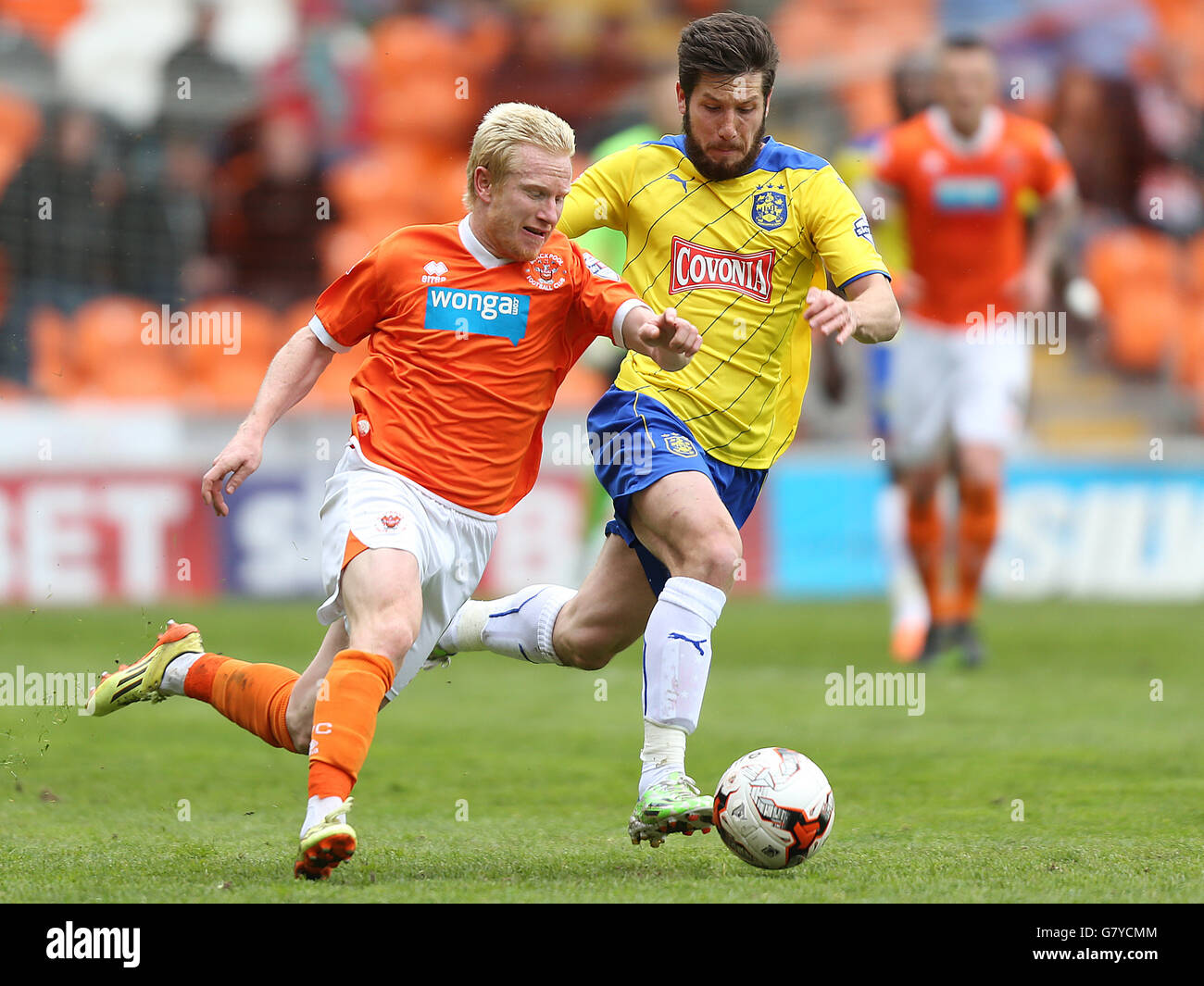Blackpool's David Perkins and Huddersfield Town's Jacob Butterfield ...