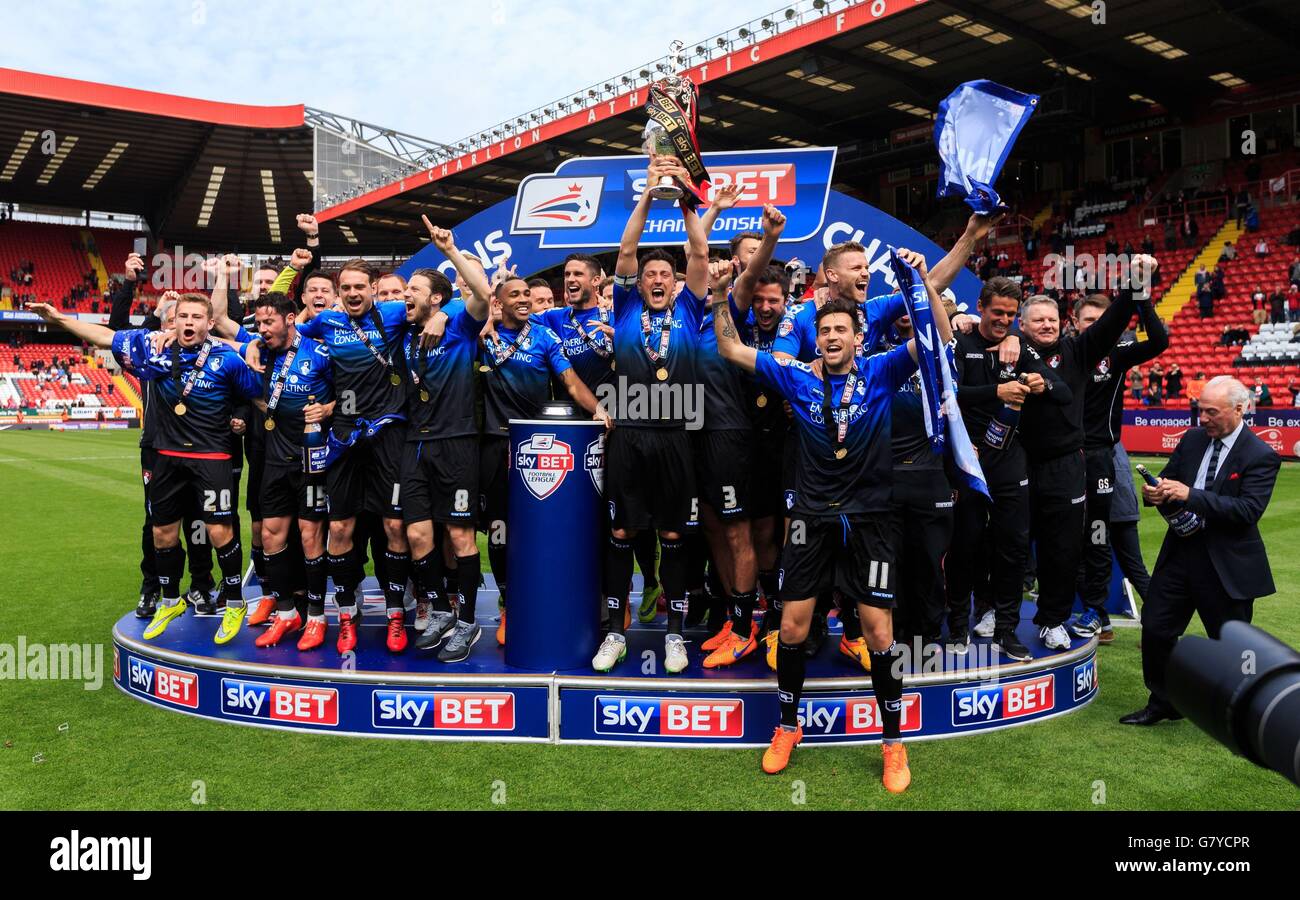 AFC Bournemouth's captain Tommy Elphick lifts the Championship trophy ...