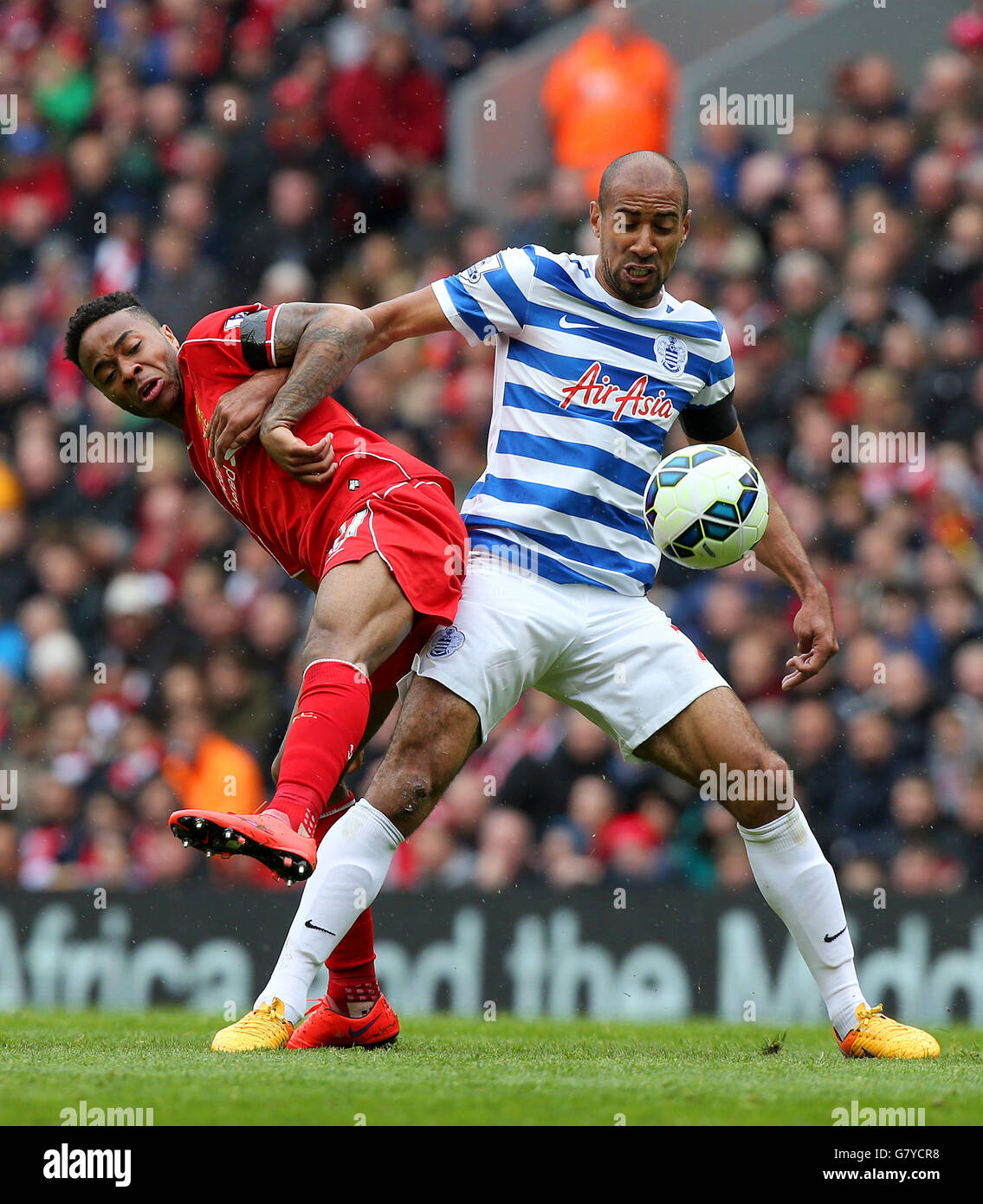 Liverpool's Raheem Sterling (left) and Queens Park Rangers' Karl Henry ...