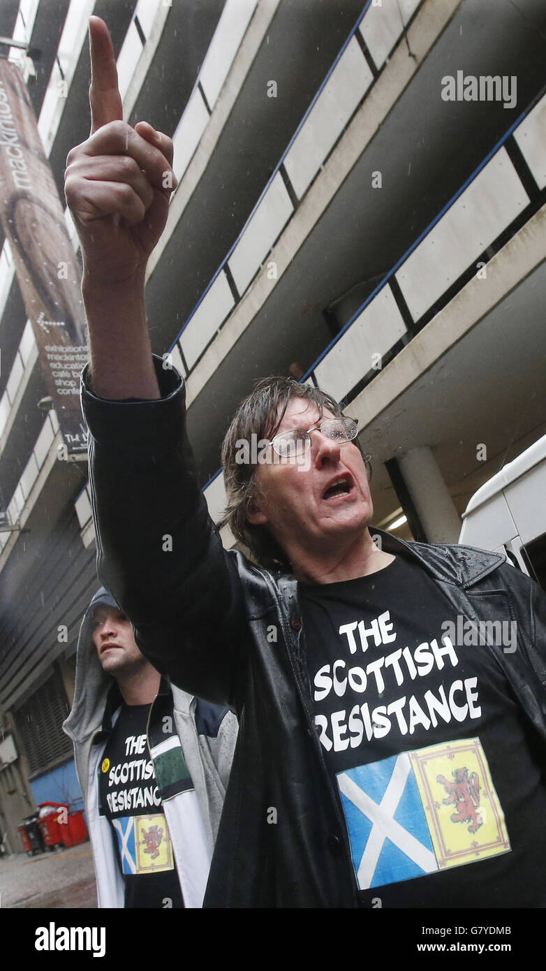 Scottish Resistance member James Scott (right) protests as former Prime ...