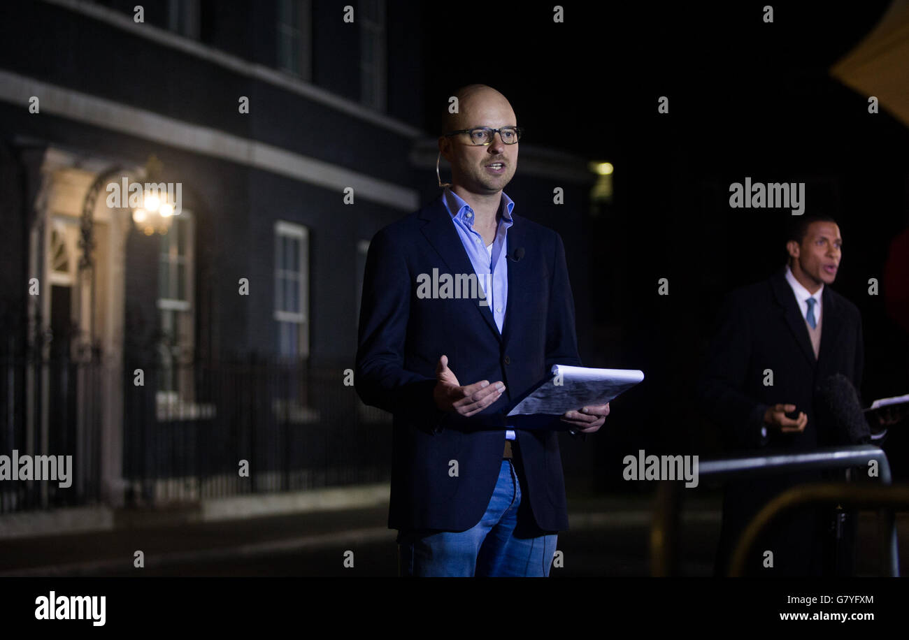 Television reporters from international broadcasters report in front of ...