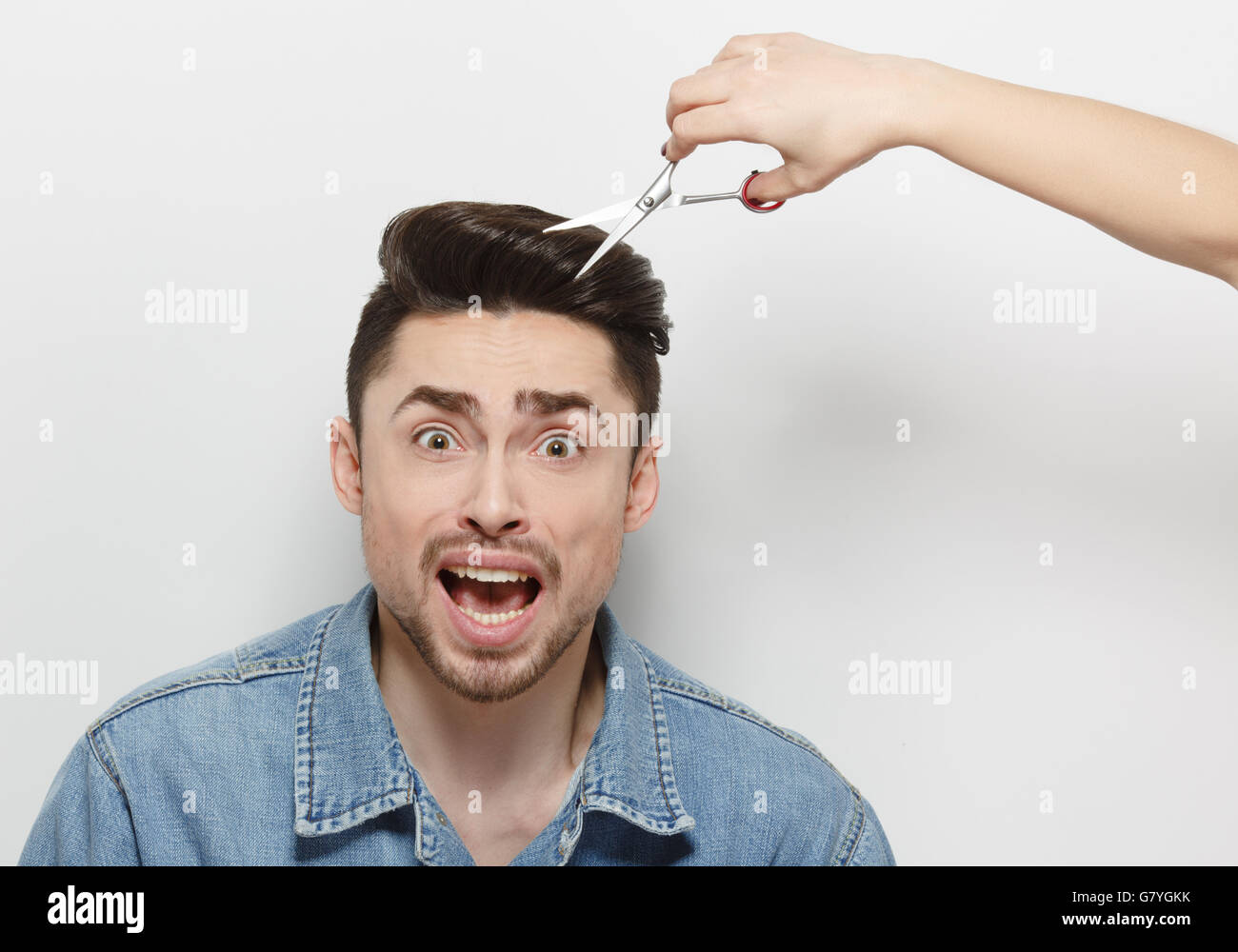 Handsome man having haircut Stock Photo - Alamy