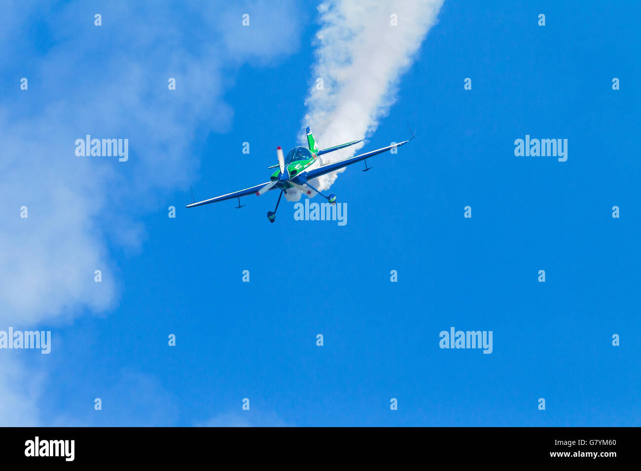 Aircraft acrobatics plane pilot flying action in blue sky closeup ...
