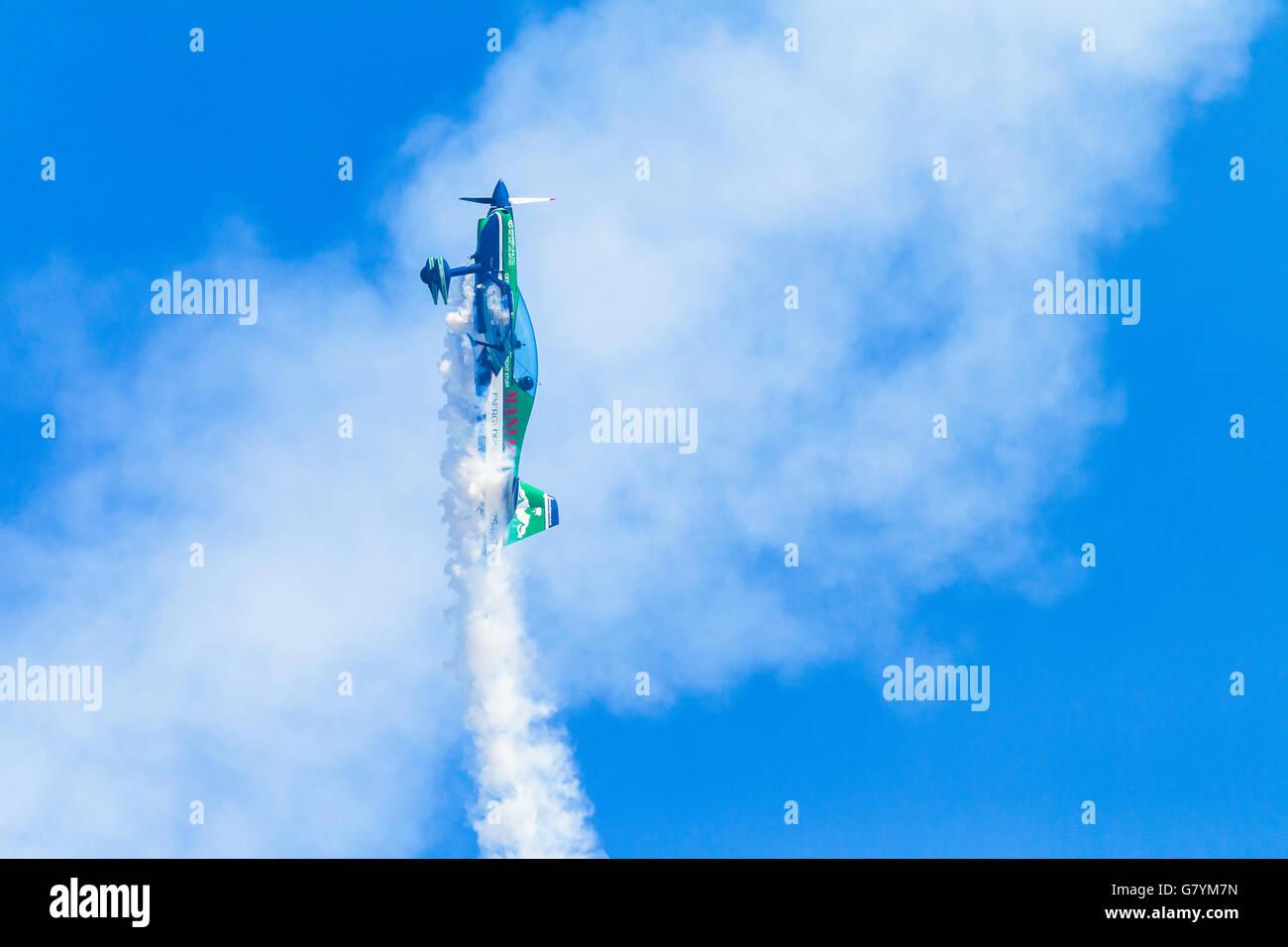 Aircraft acrobatics plane pilot flying action in blue sky closeup ...