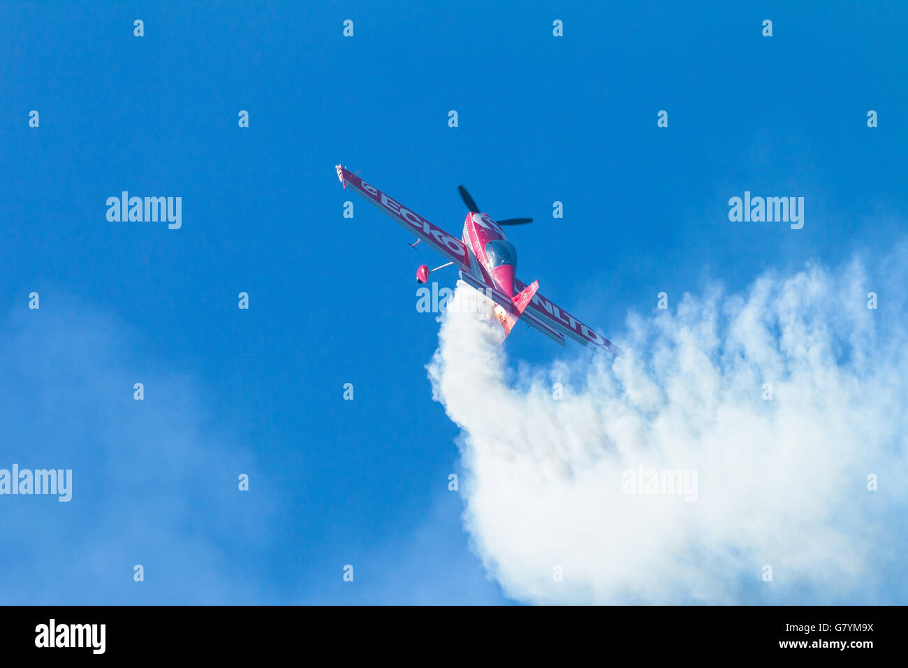 Aircraft acrobatics plane pilot flying action in blue sky closeup ...