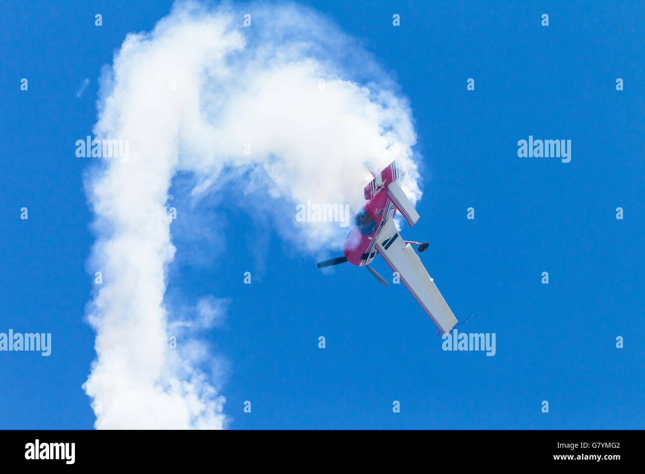 Aircraft acrobatics plane pilot flying action in blue sky closeup ...