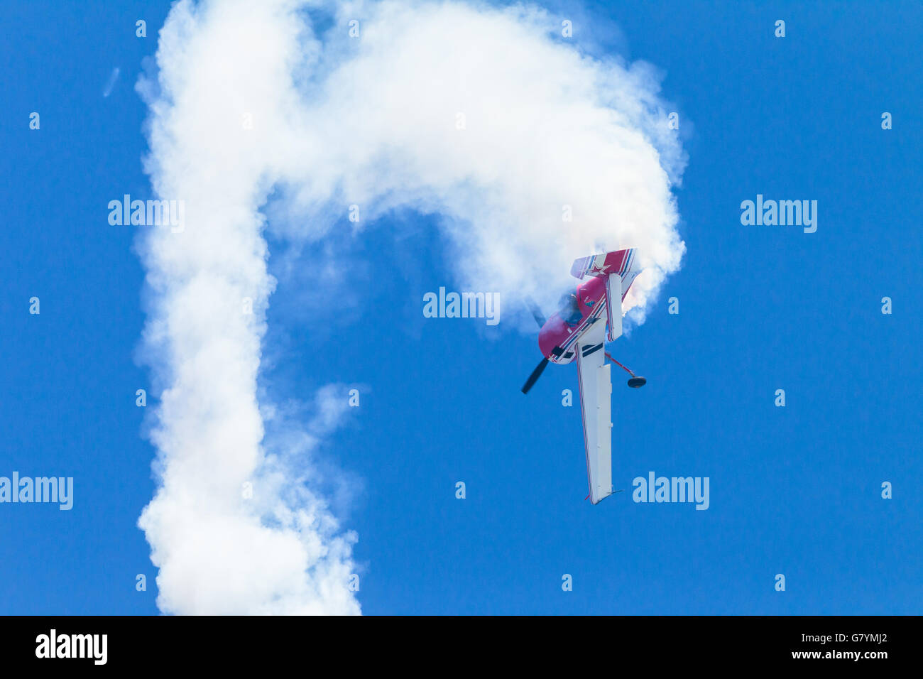 Aircraft acrobatics plane pilot flying action in blue sky closeup ...