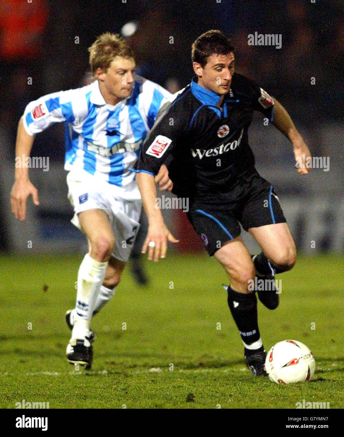 Reading's Nicky Forster (right) gets past Brighton's Kerry Mayo Stock ...