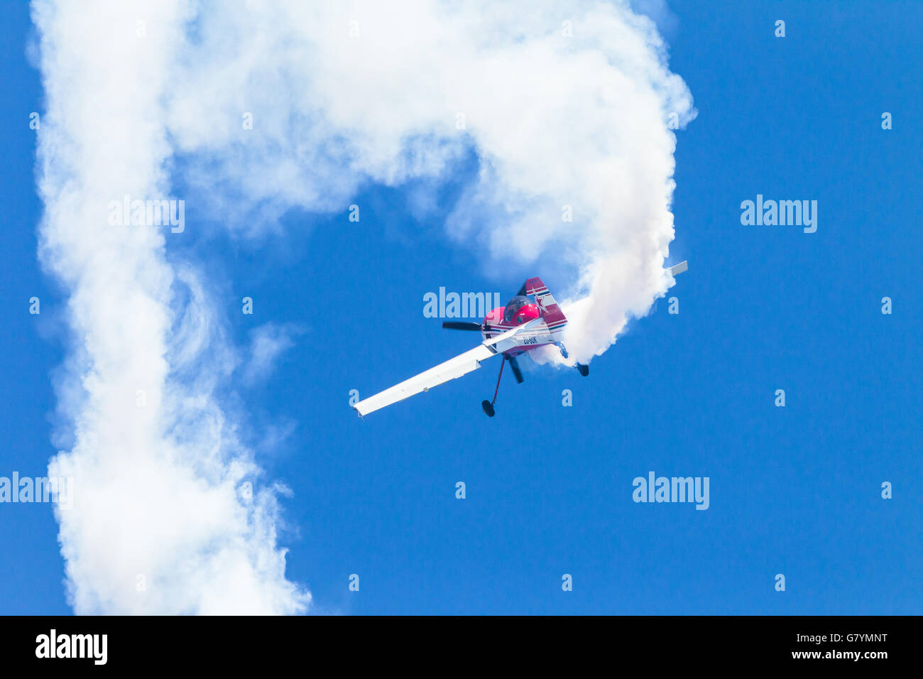 Aircraft acrobatics plane pilot flying action in blue sky closeup ...