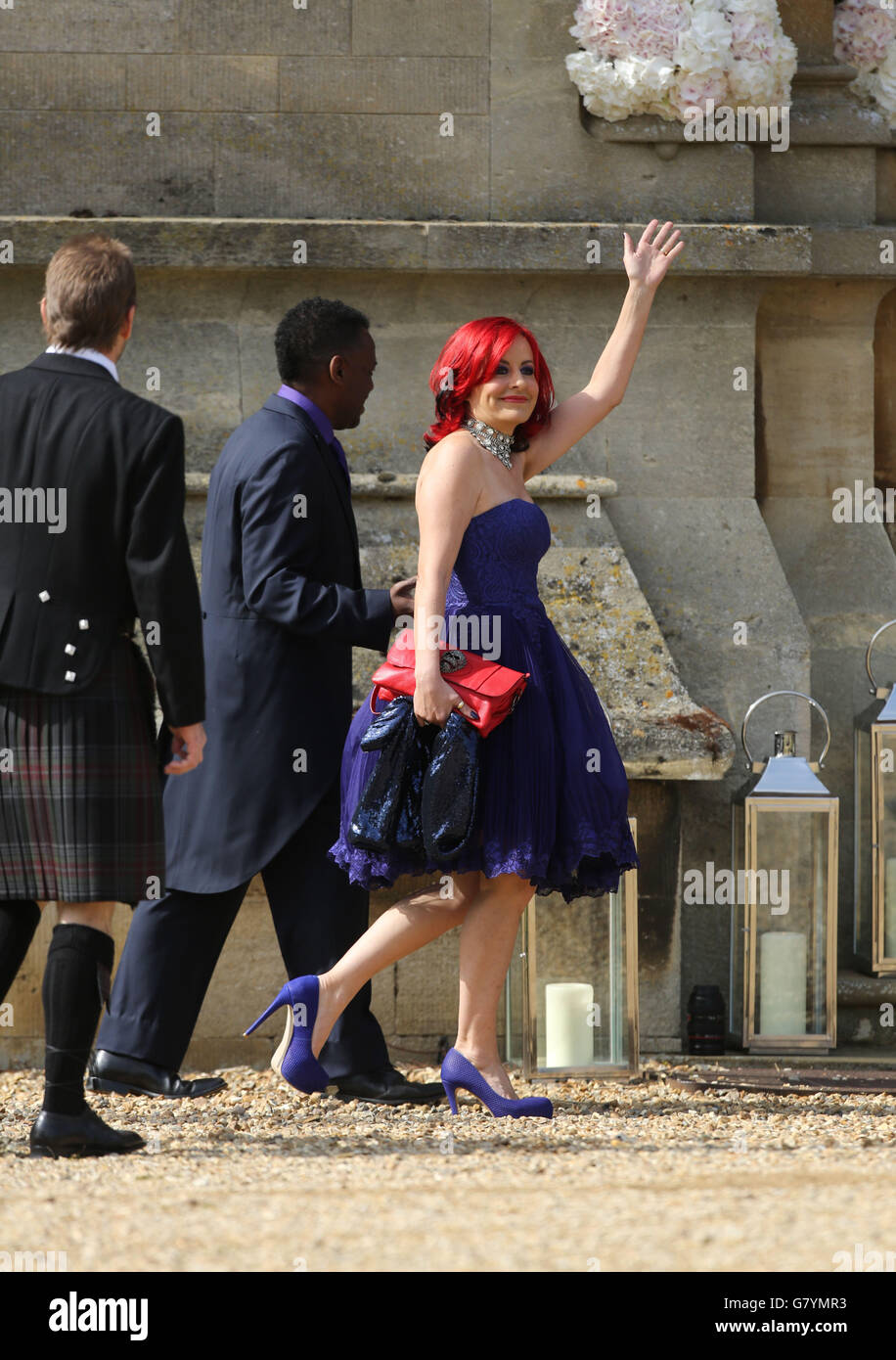 David (centre) and Carrie Grant (right) attending the wedding of Spice ...