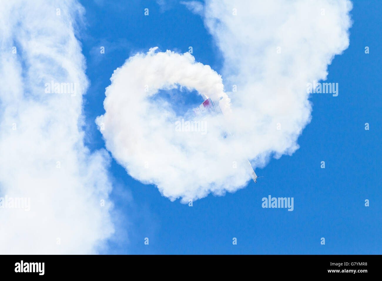 Aircraft acrobatics plane pilot flying action in blue sky closeup ...
