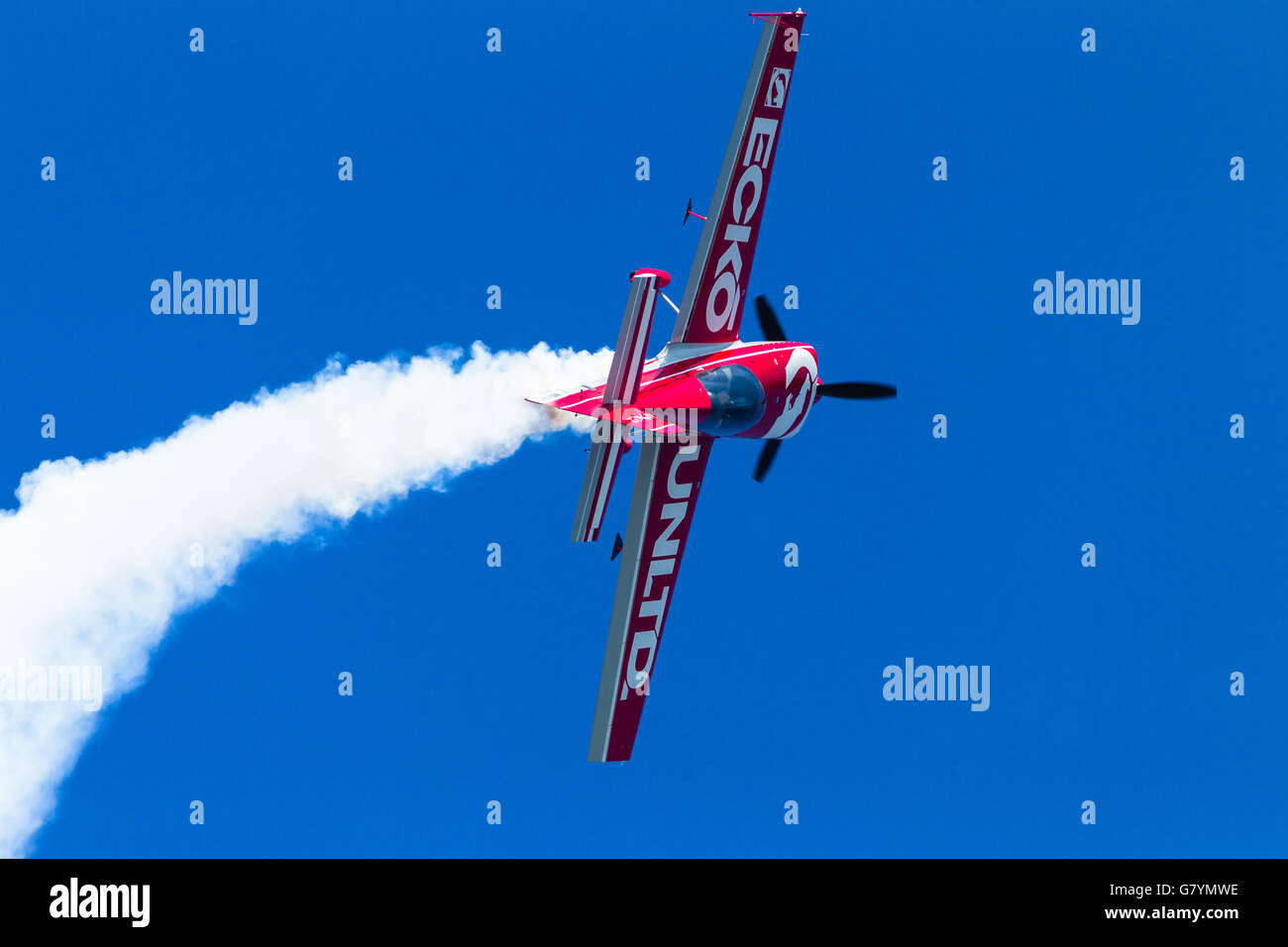 Aircraft acrobatics plane pilot flying action in blue sky closeup ...