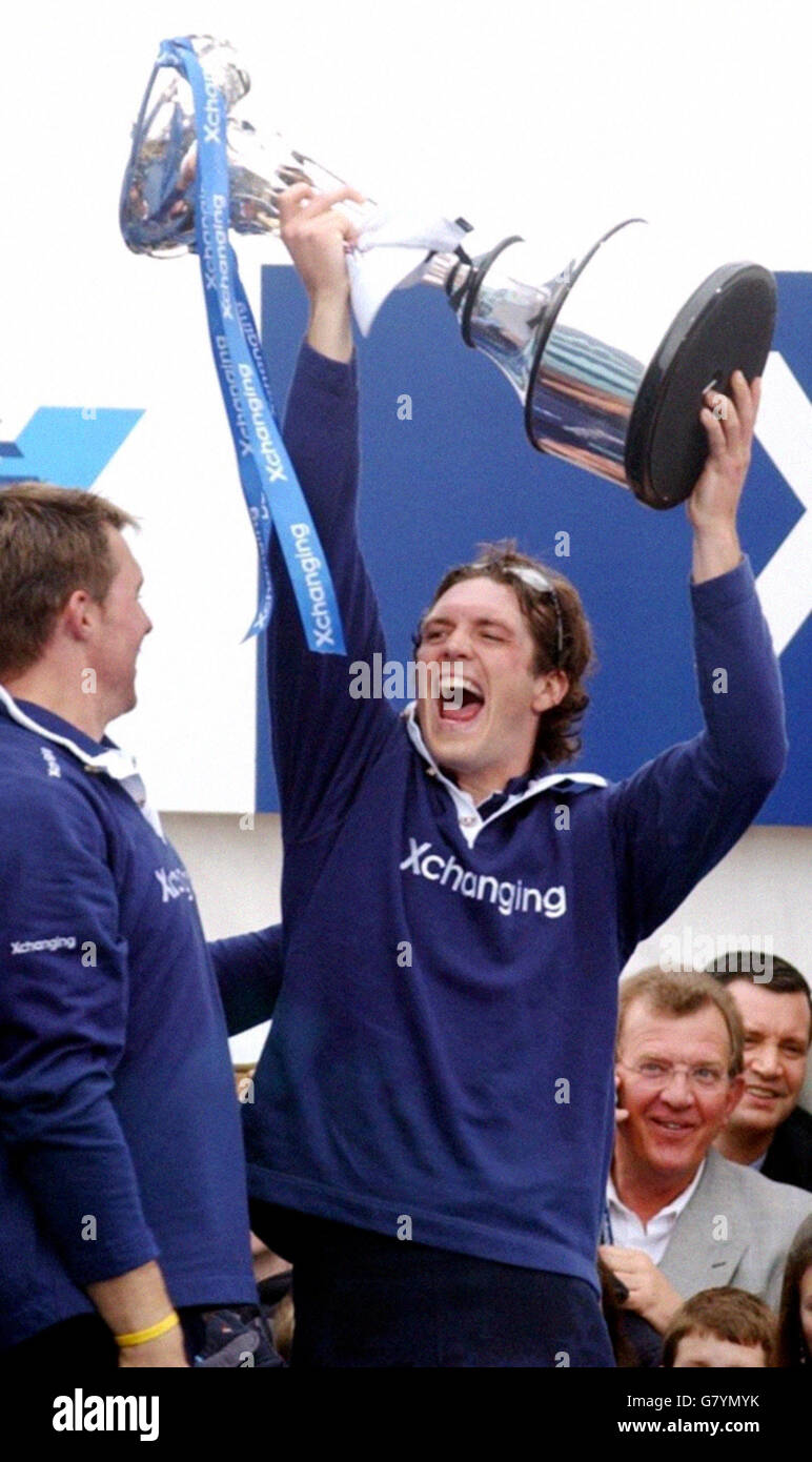 Oxford crew member Barney Williams celebrates with the trophy Stock ...