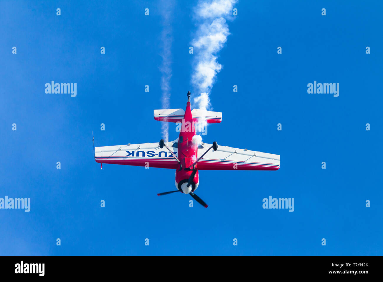 Aircraft acrobatics plane pilot flying action in blue sky closeup ...