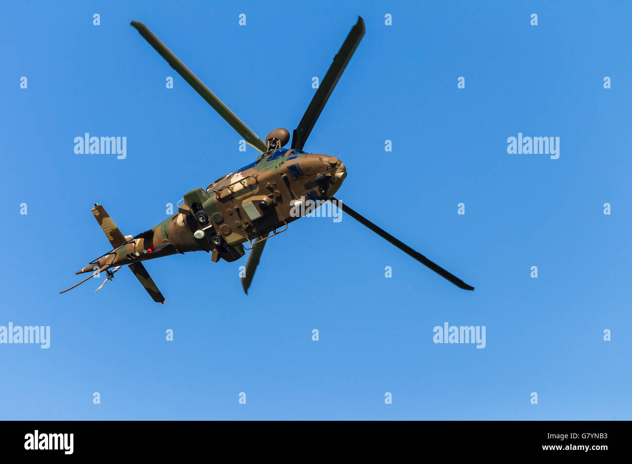 Military helicopter air show close action flyby against blue sky Stock ...