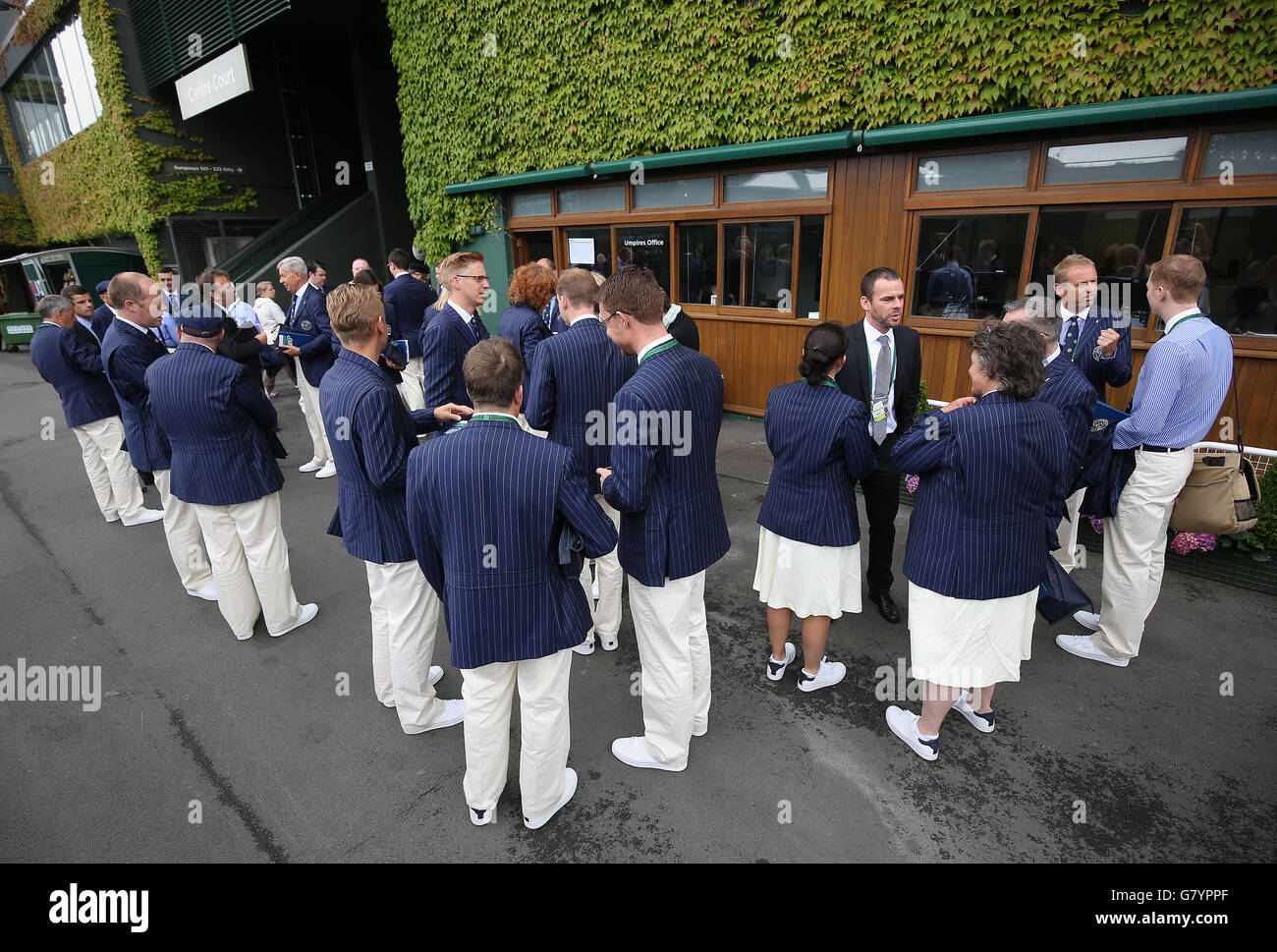 Umpires waiting outside the umpires office on day one of the Wimbledon ...