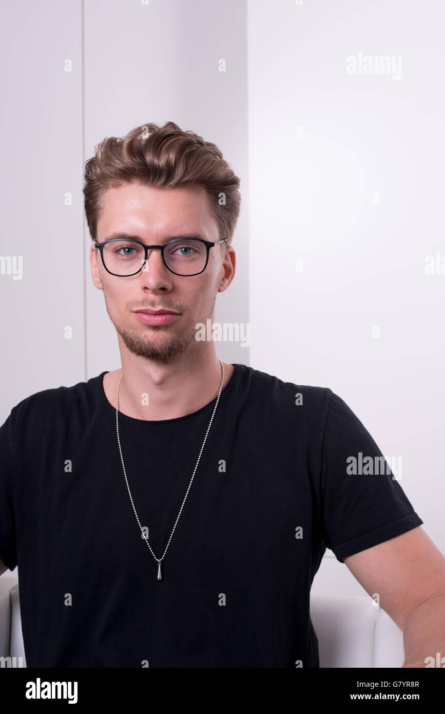 smart young professional with serious look into camera Stock Photo - Alamy