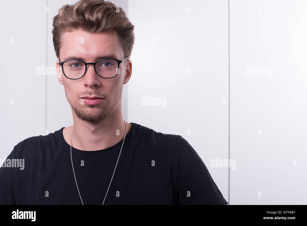 smart young professional with serious look into camera Stock Photo - Alamy