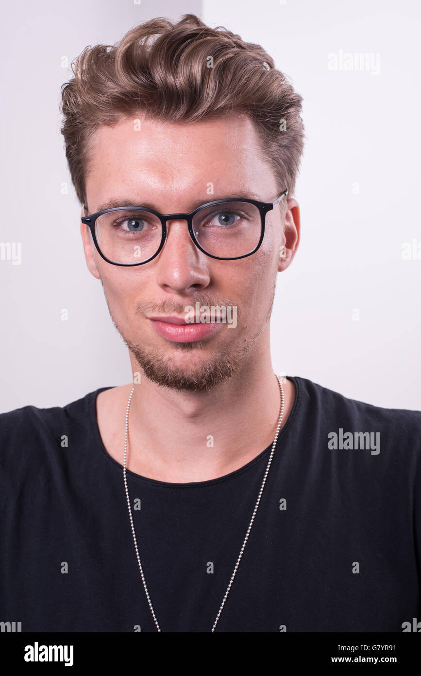 smart young professional with serious look into camera Stock Photo - Alamy