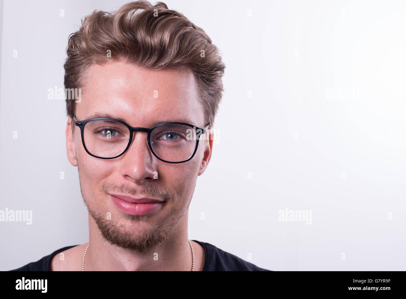 smart young professional smiling into the camera Stock Photo - Alamy