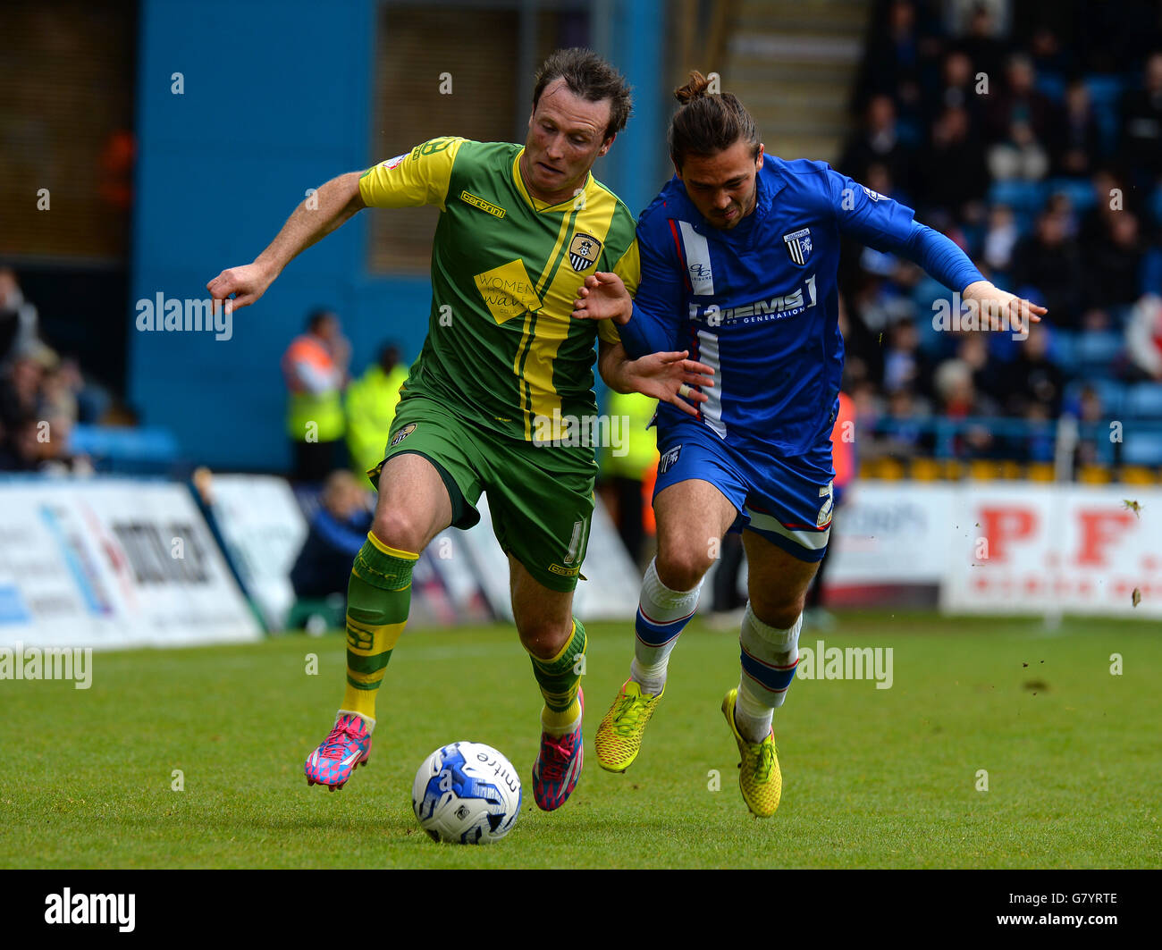 Notts County's Garry Thompson holds off a challenge from Gillingham's ...