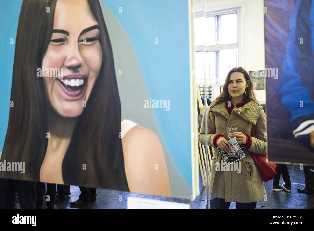Simona Viackute looks at a portrait of her, painted by artist Bernice ...