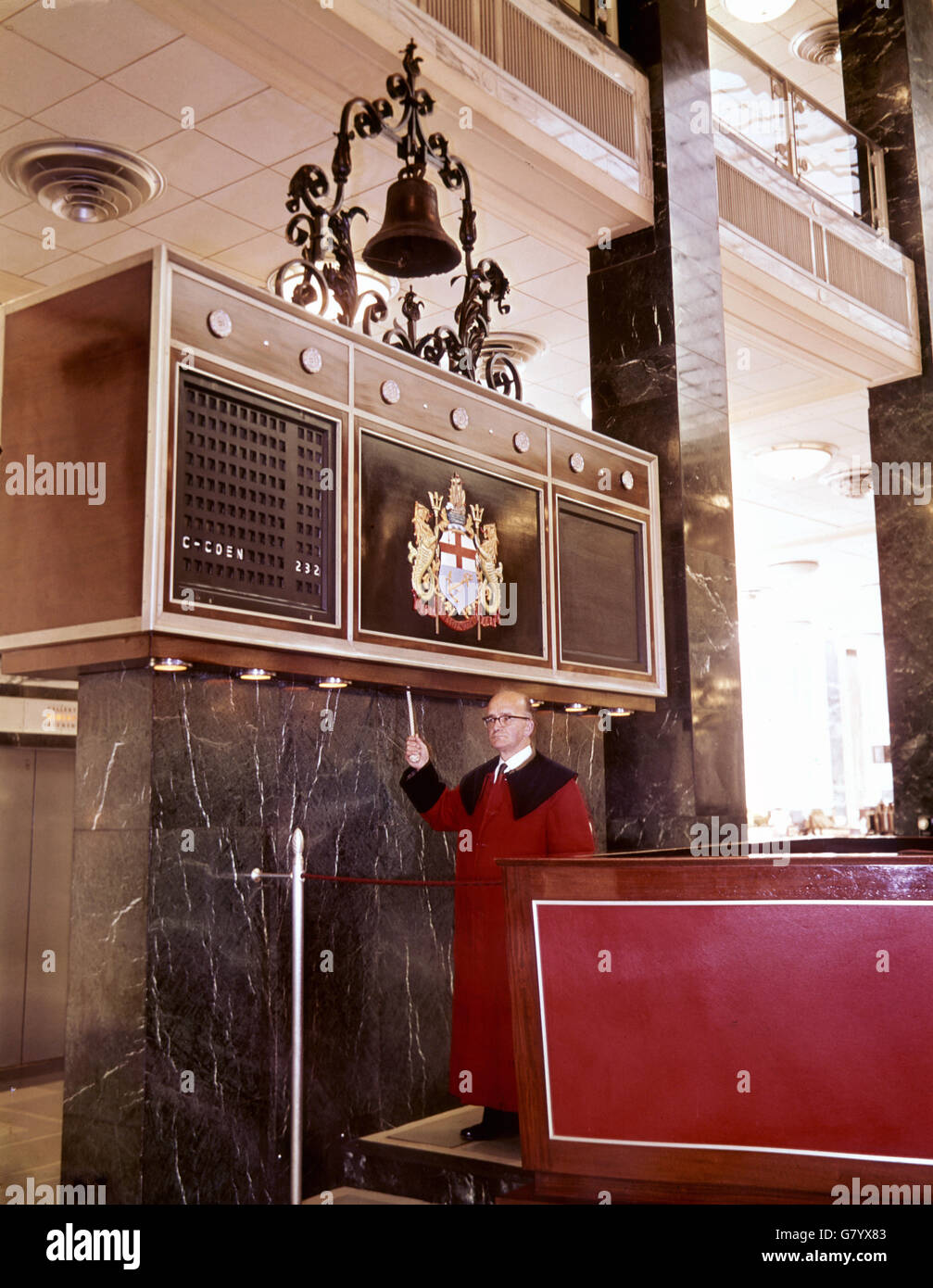 The Lutine Bell at Lloyds, above the City of London Coat of Arms, is ...