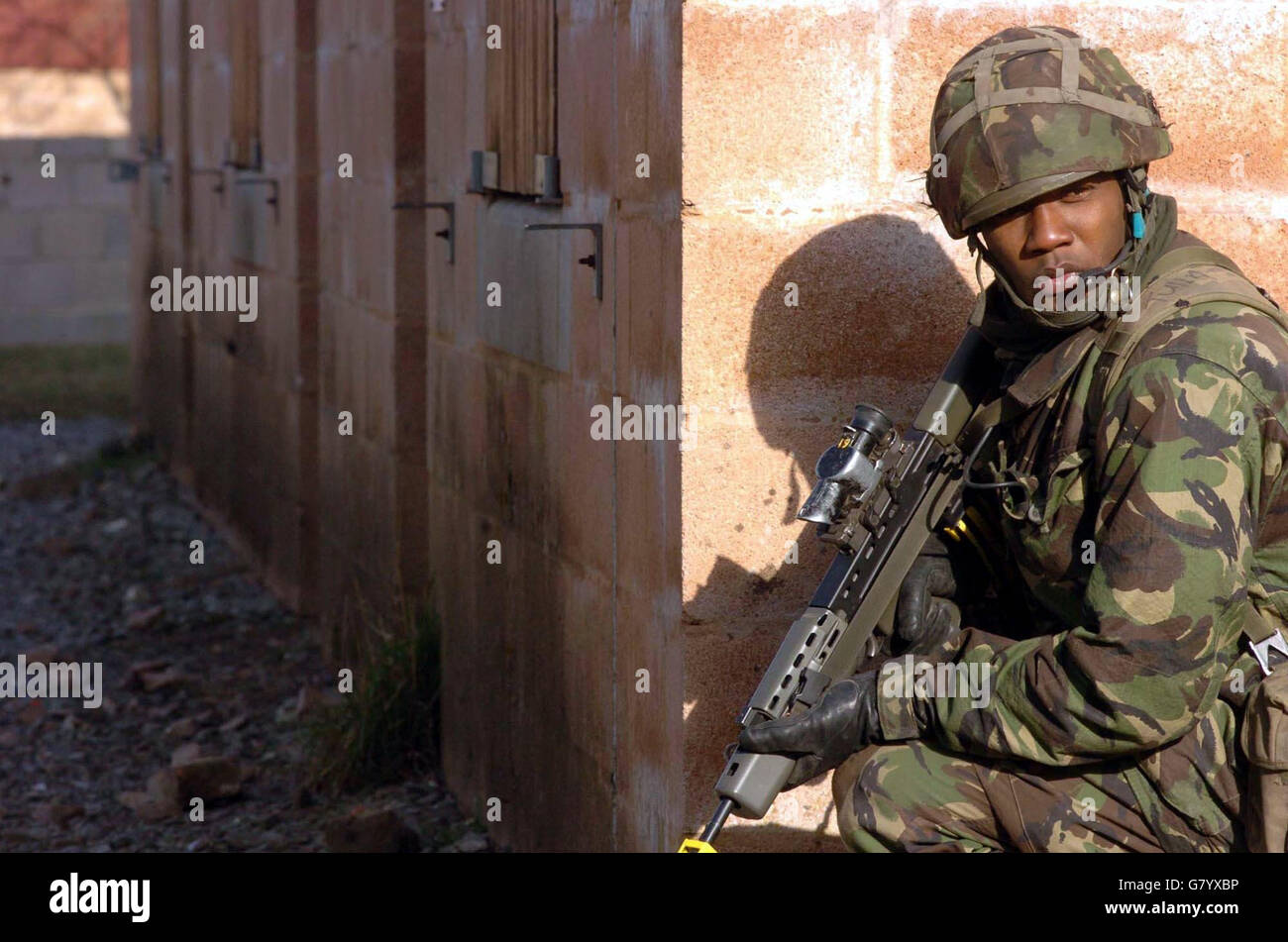 An unidentified soldier takes up a patrol position during an army ...