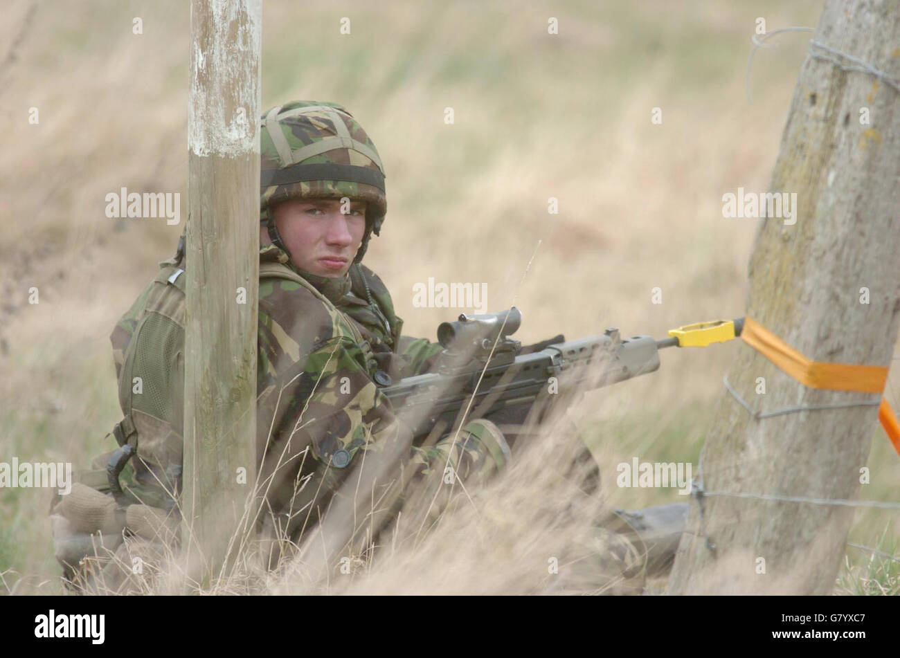 An unidentified soldier takes up a patrol position during military ...