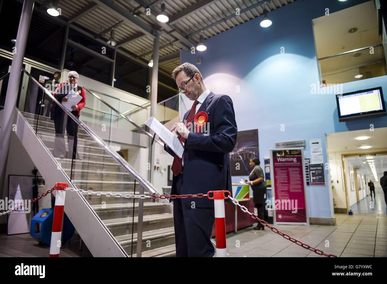 A Labour supporter makes notes as he watches the Election broadcast ...