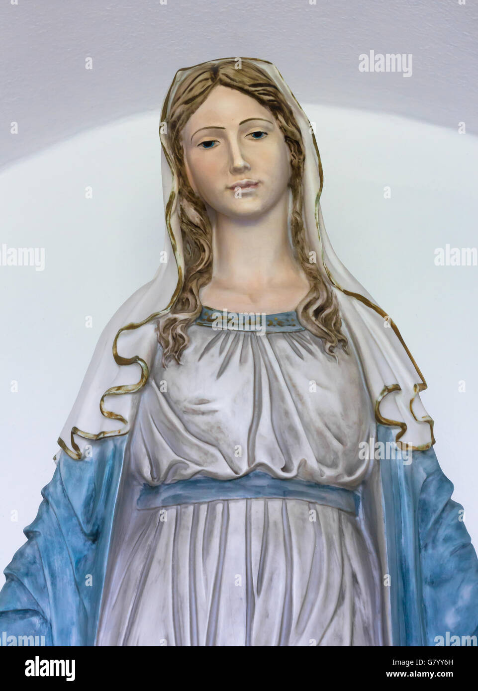 Statue of holy woman isolated on light background Stock Photo - Alamy