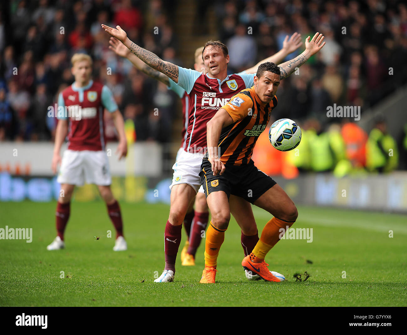 Hull City's Jake Livermore and Burnley's Matthew Taylor during the ...