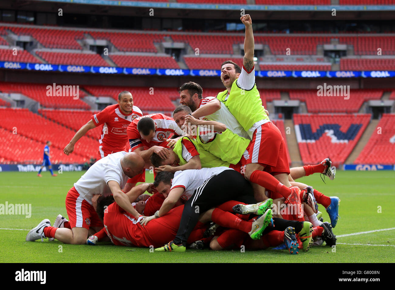 North Shields' Adam Forster (obscured) is mobbed by team-mates as he ...