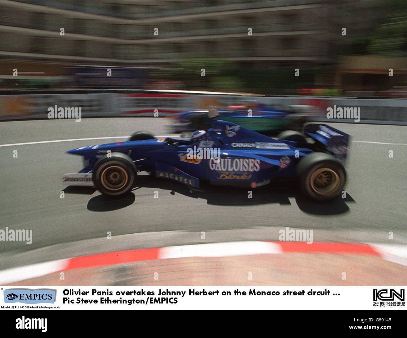 Olivier Panis overtakes Johnny Herbert on the Monaco street circuit ...