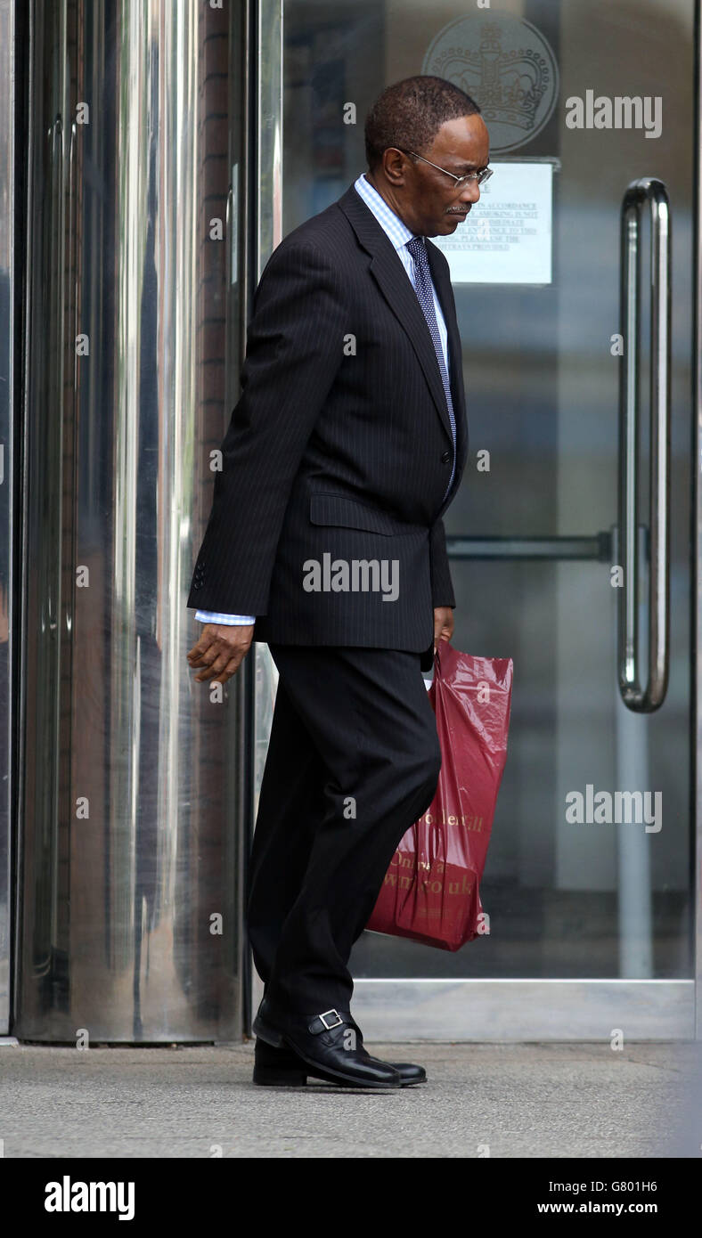 Dr Emmanuel Edet leaves Harrow Crown Court, where he is accused, along ...
