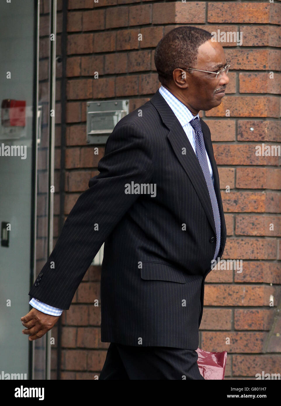 Dr Emmanuel Edet leaves Harrow Crown Court, where he is accused, along ...