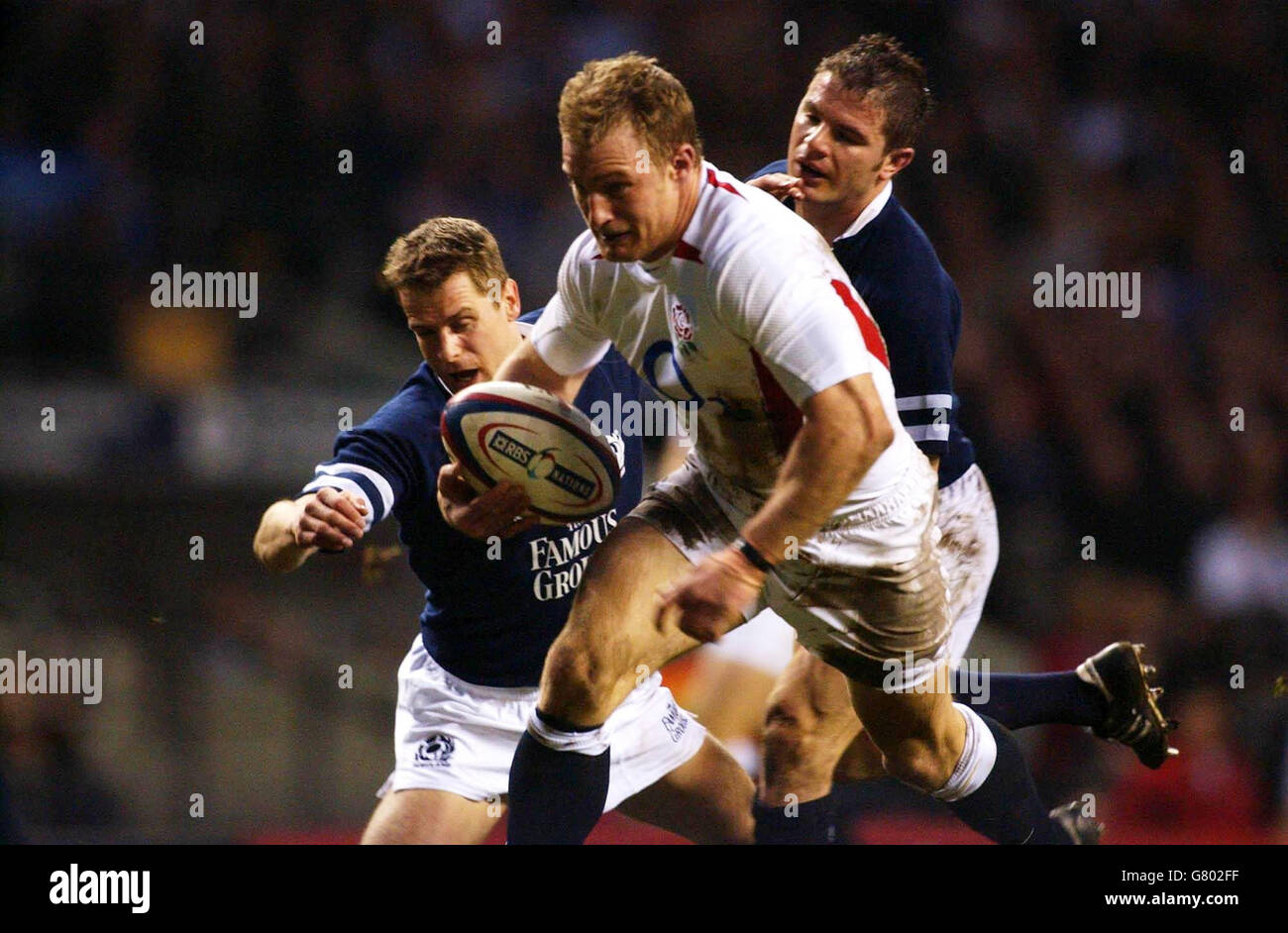 England's Jamie Noon gets past Scotland's defence to score the second ...
