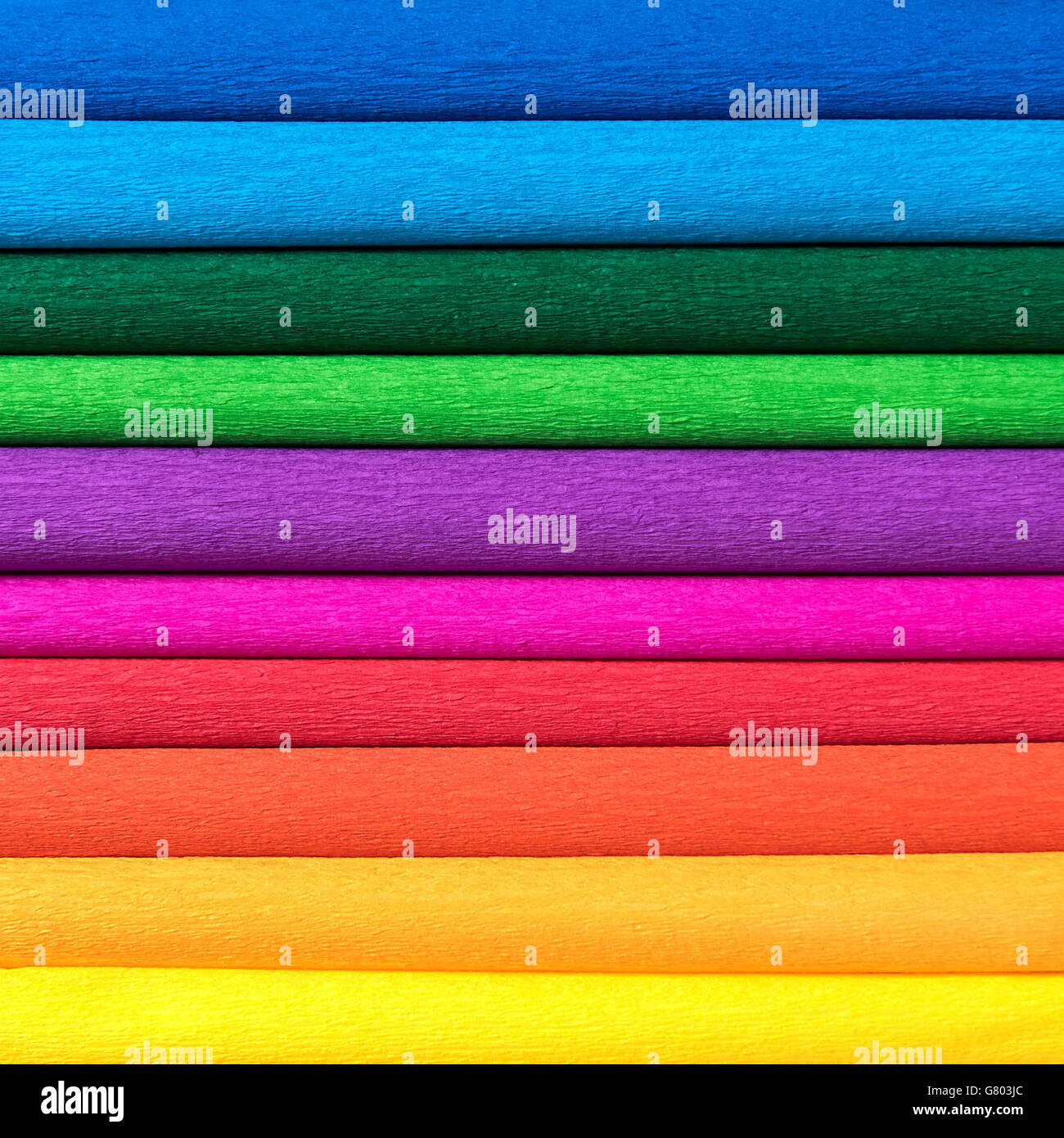 rolls of colored corrugated paper closeup on background Stock Photo - Alamy